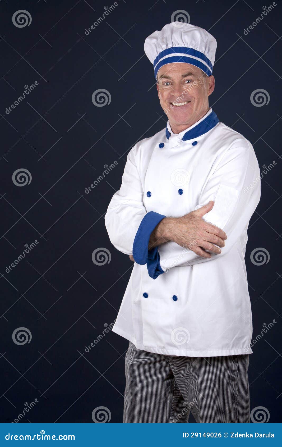 Mature Chef Arranging Fresh Cake In Display Cabinet At Restaurant ...