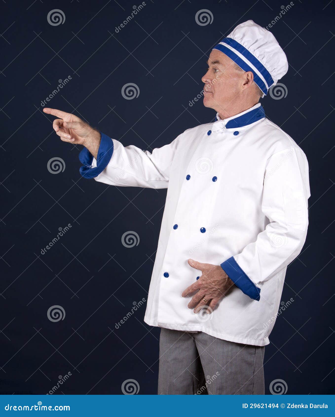 Mature Chef Arranging Fresh Cake In Display Cabinet At Restaurant ...