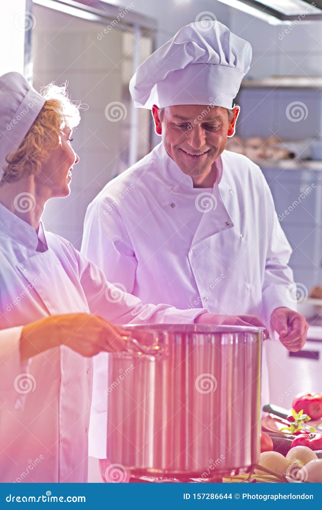 Mature Chefs Cooking in Pot at Restaurant Kitchen Stock Photo - Image ...