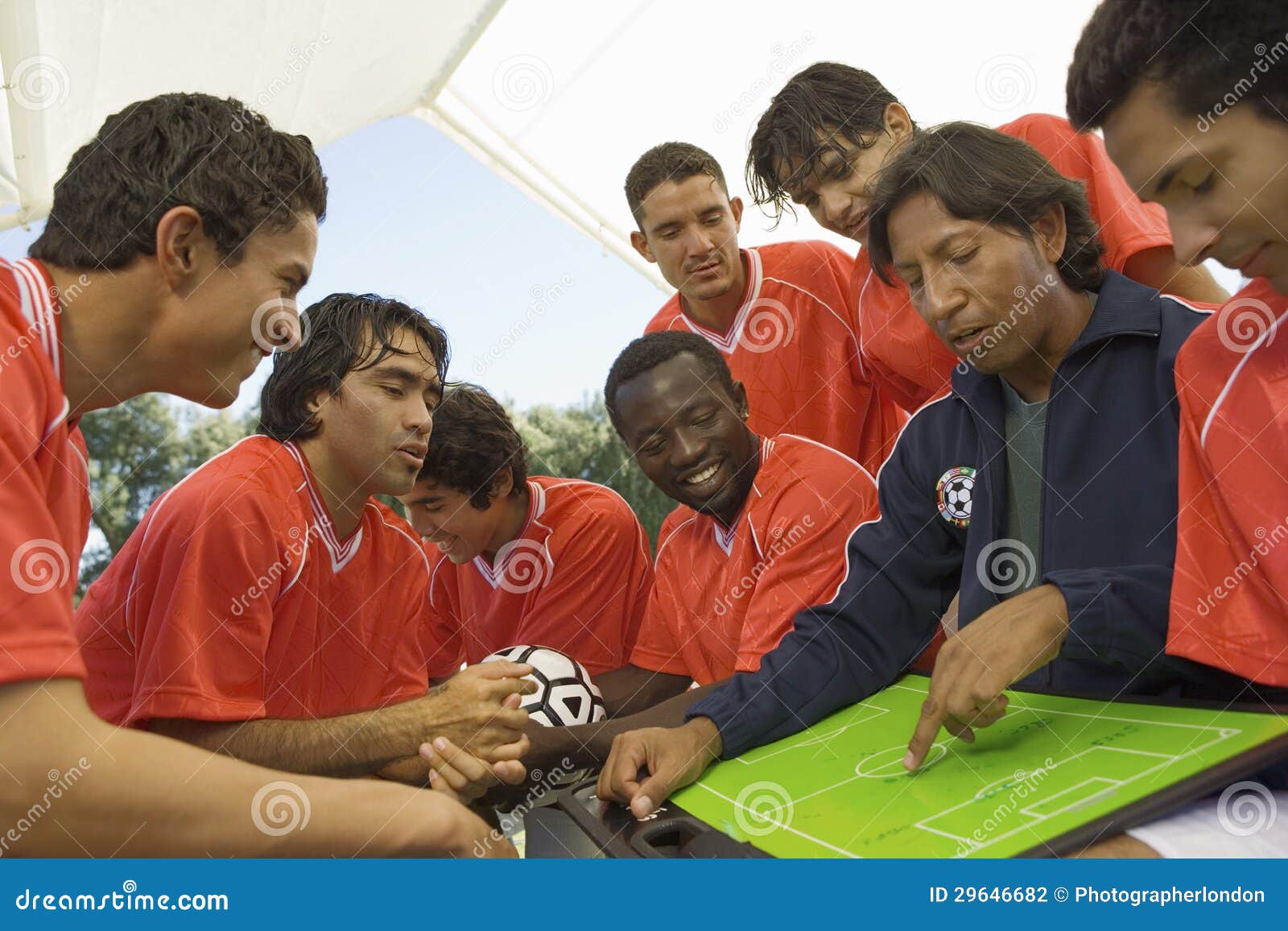 Mature Coach Giving Strategy To Players Stock Photo - Image of ethnic ...