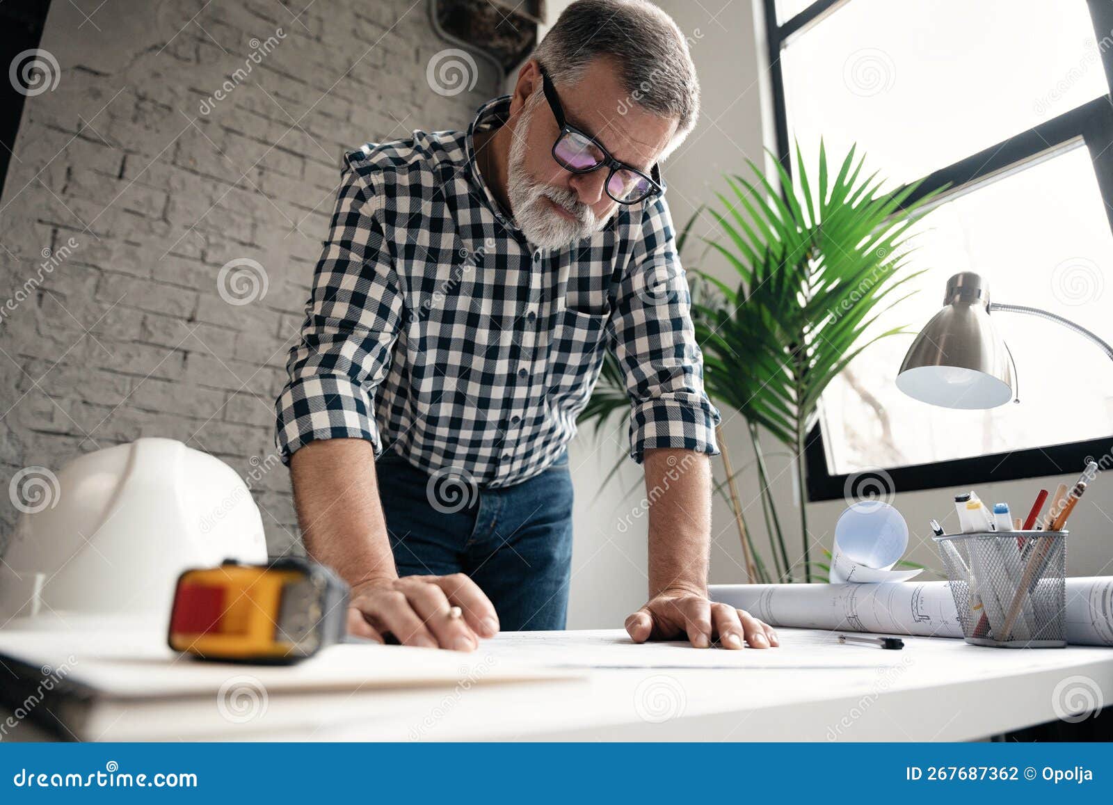 Mature Confident Smiling Architect in Casual Wear Working with ... Mature Confident Smiling Architect in Casual Wear Working with ...