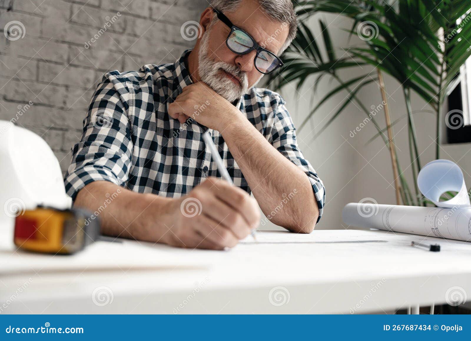 Mature Confident Smiling Architect in Casual Wear Working with ... Mature Confident Smiling Architect in Casual Wear Working with ...