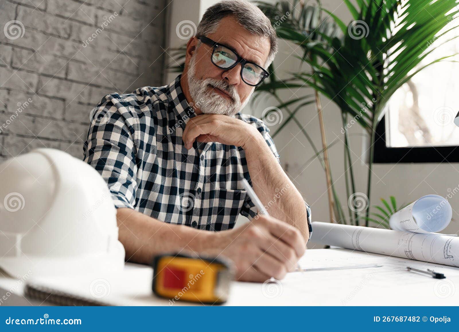 Mature Confident Smiling Architect in Casual Wear Working with ... Mature Confident Smiling Architect in Casual Wear Working with ...
