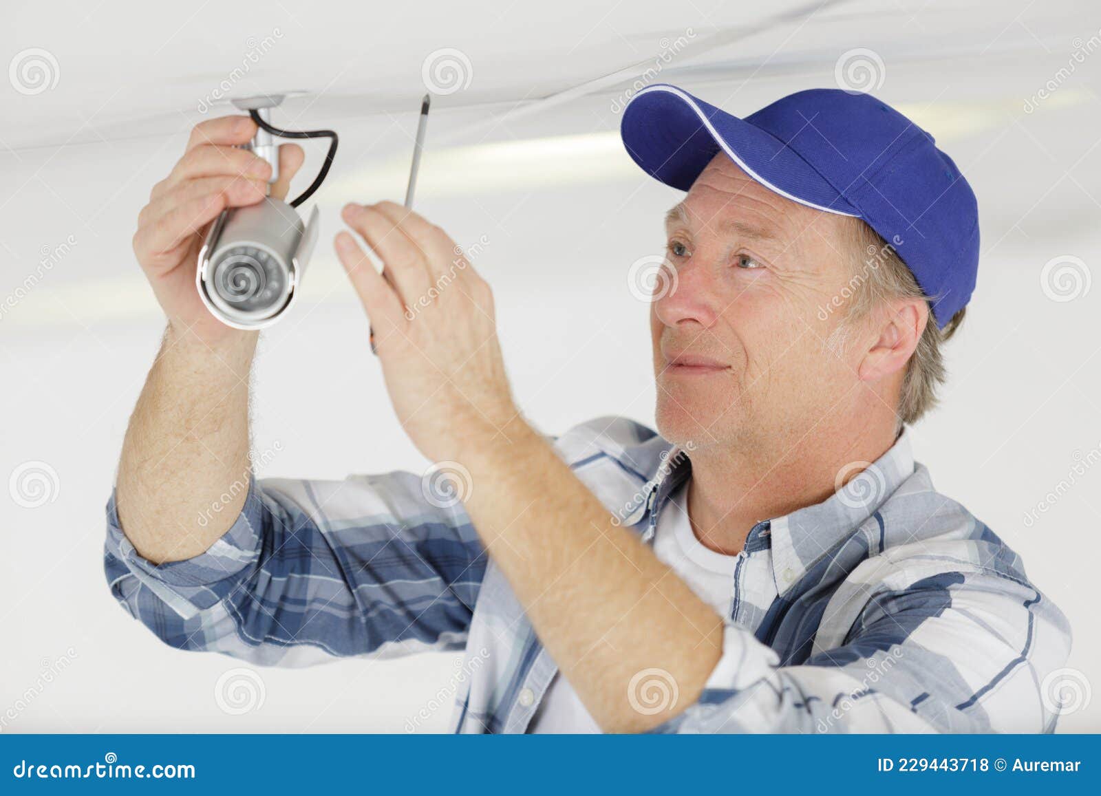 Mature Contractor Installing Cctv Camera on Ceiling Stock Photo - Image ...