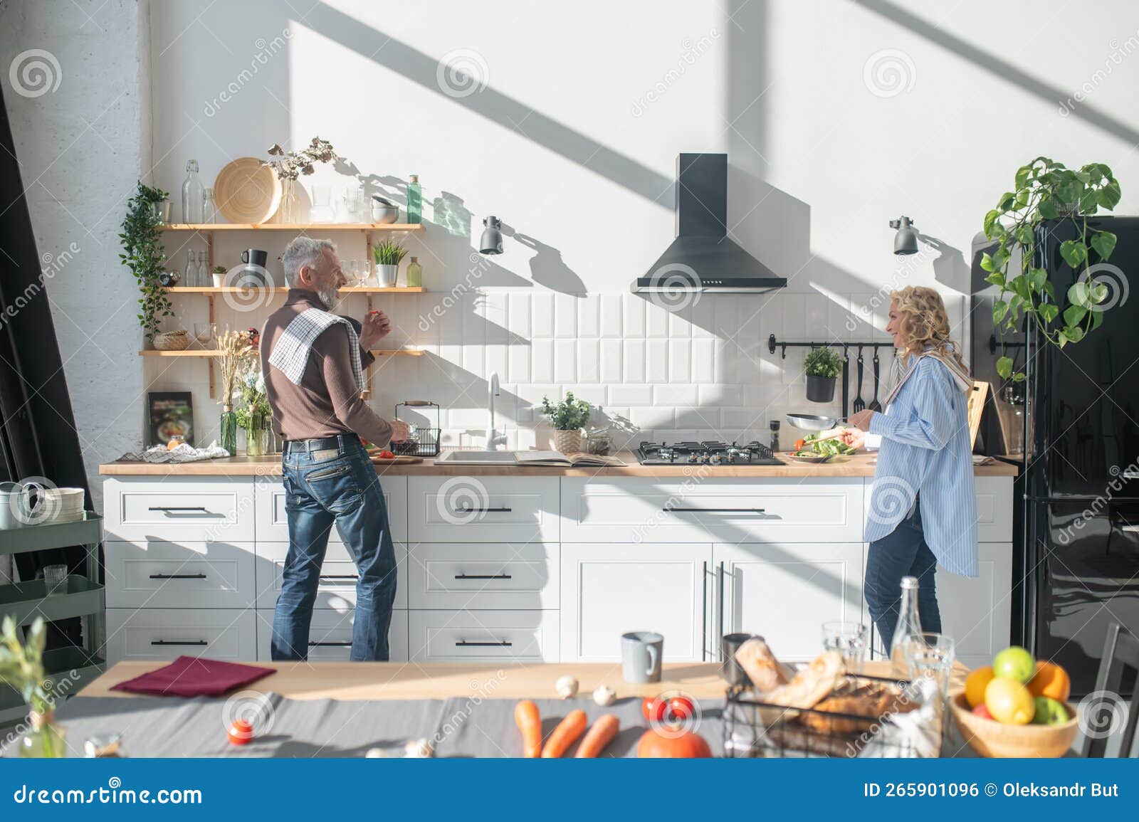 Mature Couple Cooking Breakfast Together Stock Photo - Image of kitchen ...