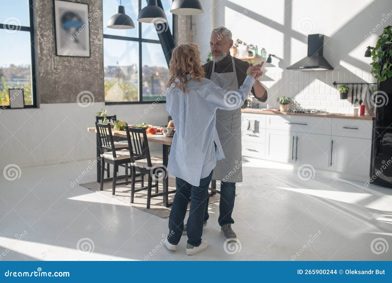A Mature Couple Dancing in the Kitchen Stock Photo - Image of ...