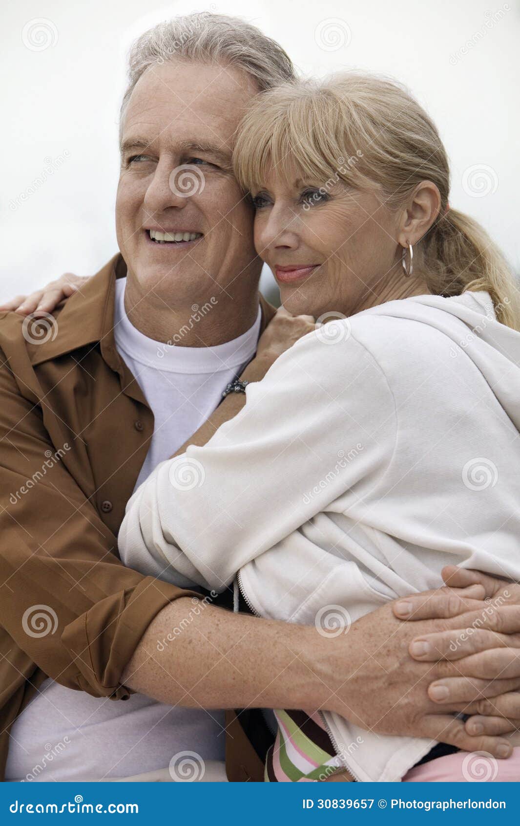 Mature Couple Embracing Outdoors Stock Image - Image of clothing ...