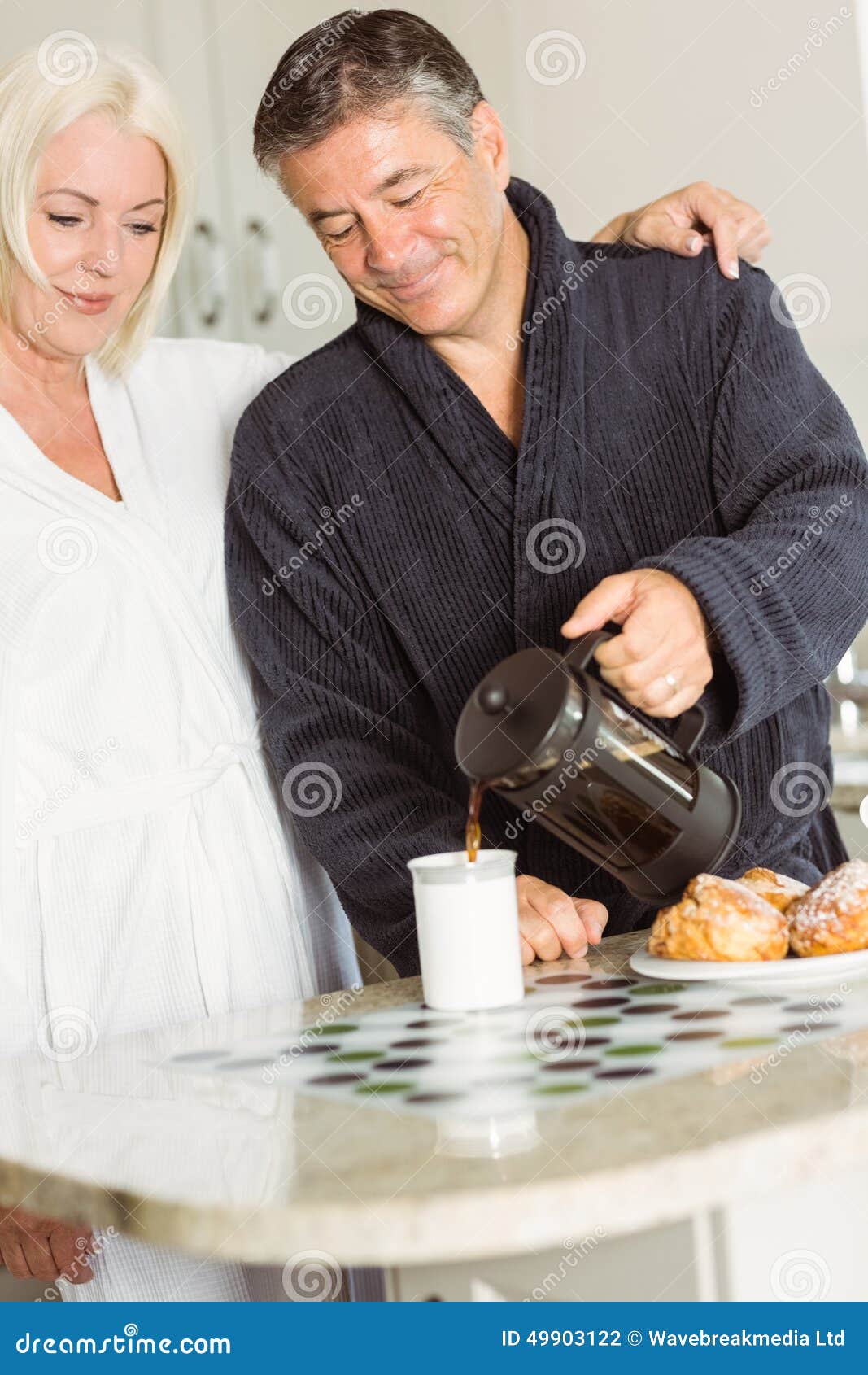 Mature Couple Having Breakfast Together Stock Photo - Image of counter ...