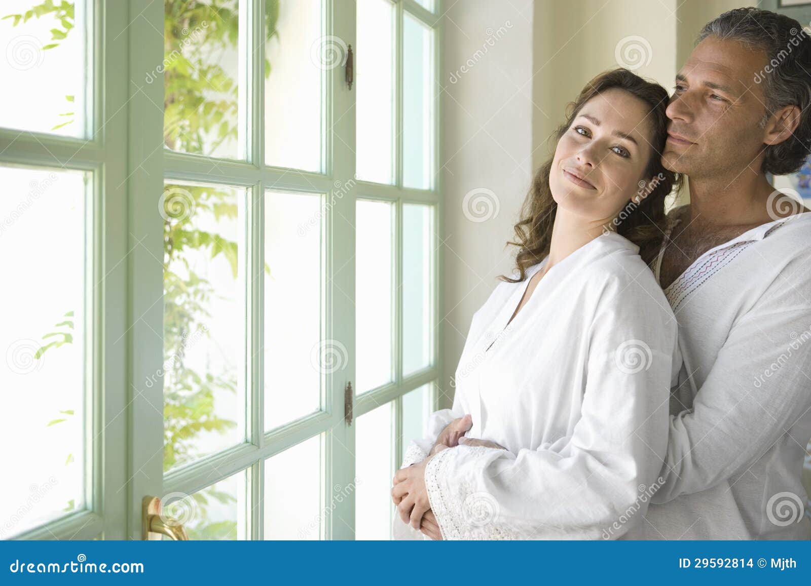 Mature Couple Hugging by Garden Doors. Stock Photo - Image of affection ...