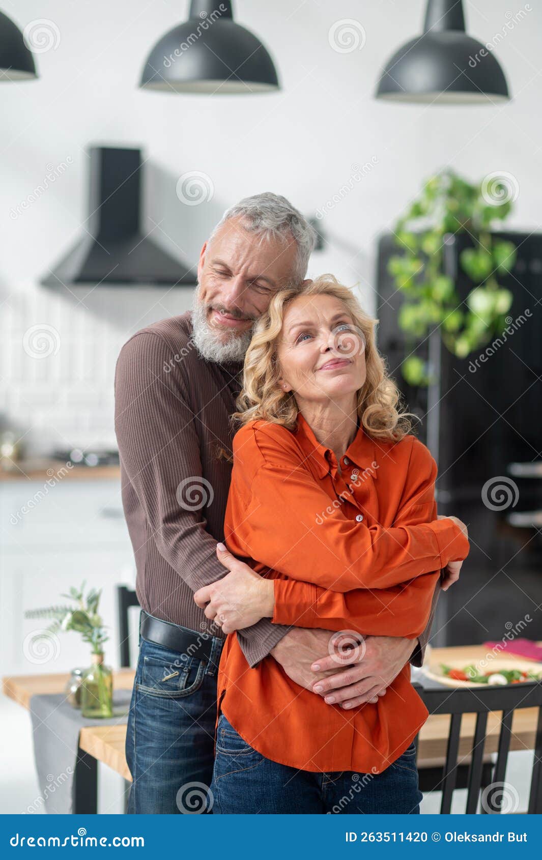 A Mature Couple Hugging and Looking Peaceful and in Love Stock Photo ...