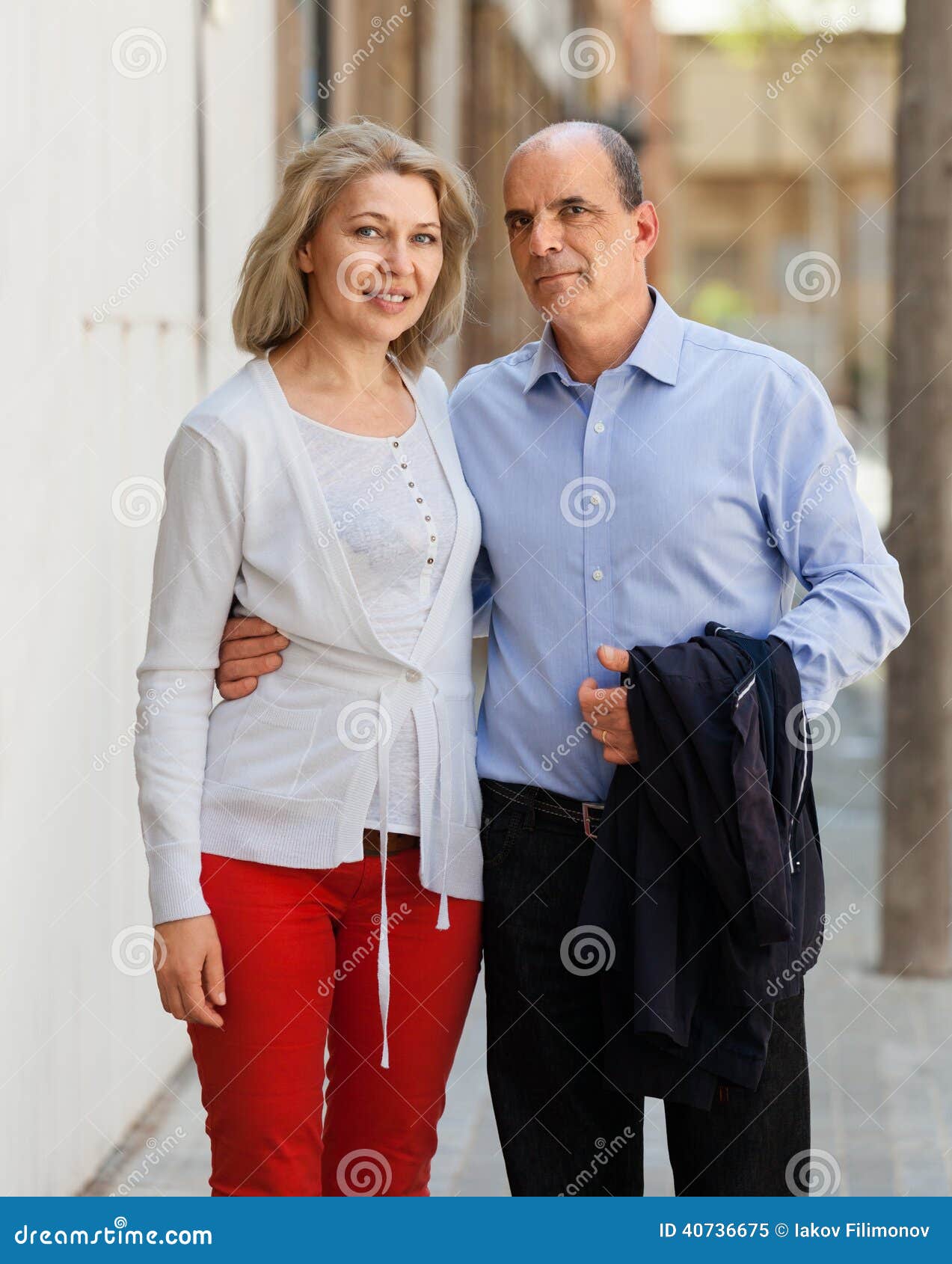 MAture Couple Hugging while Walking Stock Image - Image of couple ...