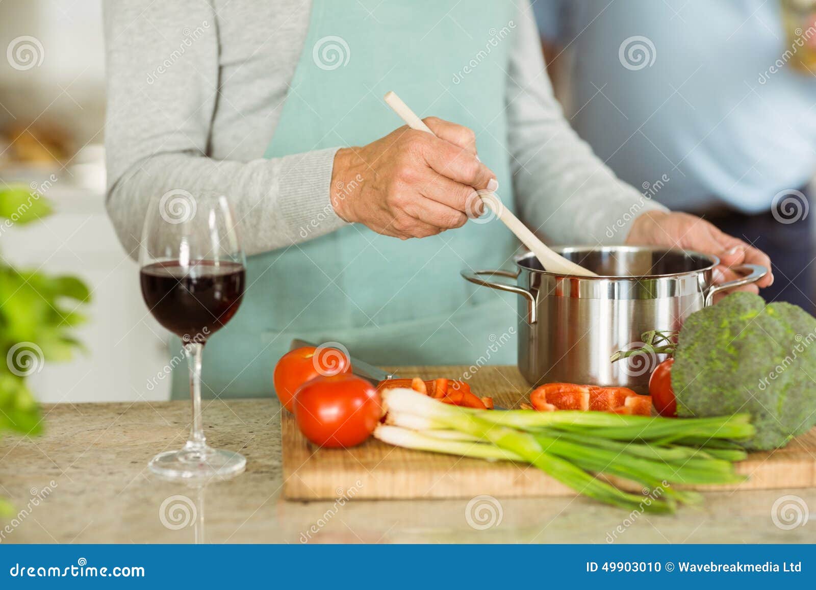 Mature Couple Making Dinner Together Having Red Wine Stock Photo ...
