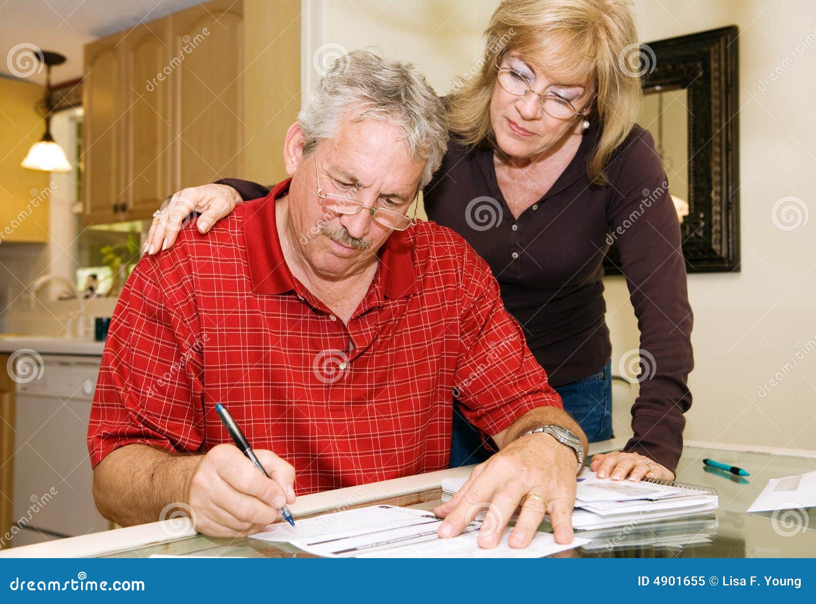 Mature Couple - Signing Paperwork Stock Image - Image of indoors ...