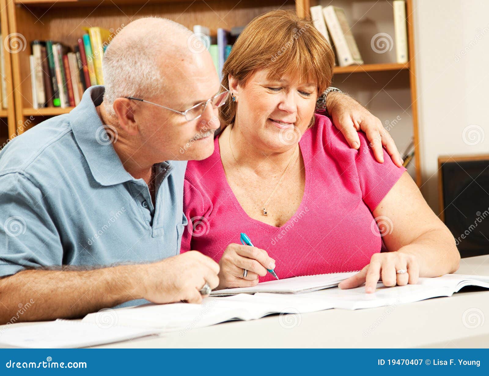 Mature Couple Studies in Library Stock Image - Image of couple, adult ...