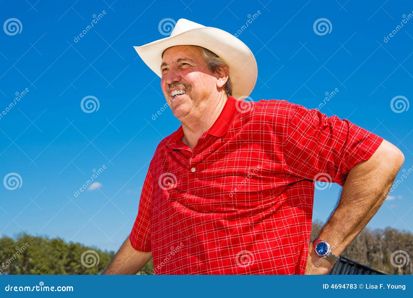 Mature Cowboy Looking Up At Weight Scale Royalty-Free Stock Photography ...