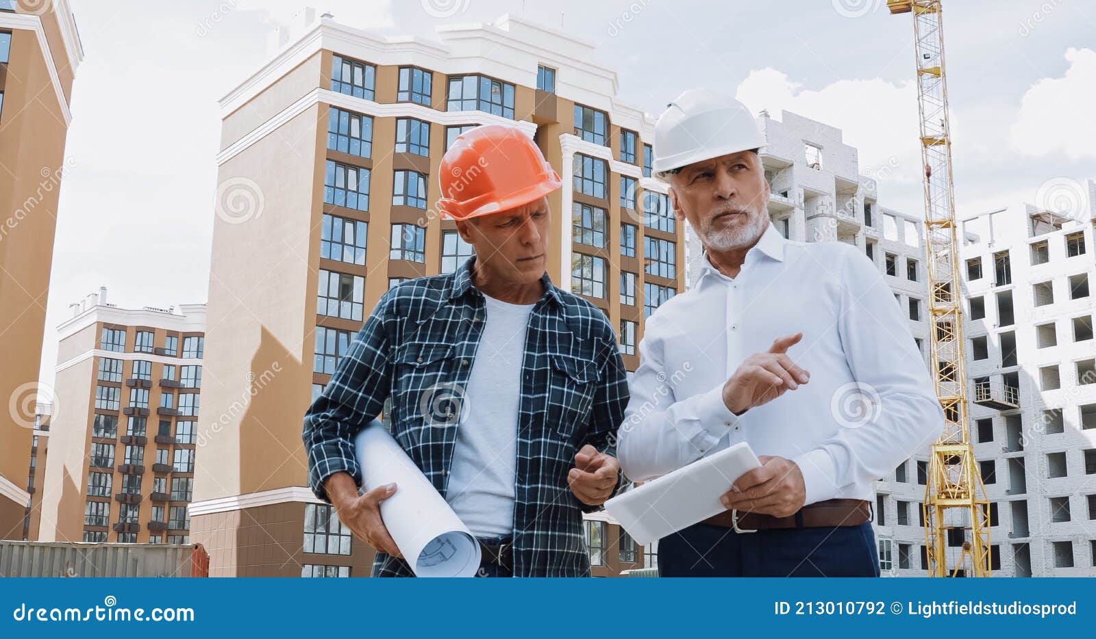 Mature Engineer and Builder with Gadget Stock Photo - Image of ...