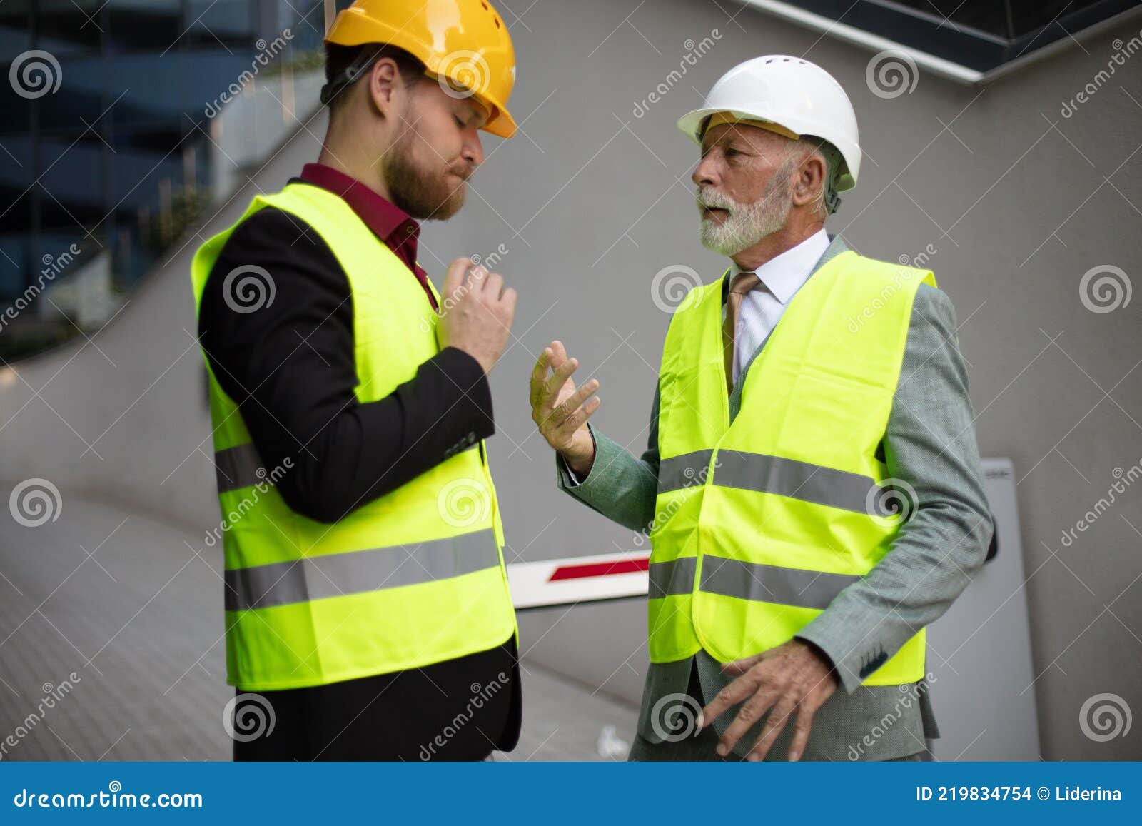 Mature Engineer Discussing the Structure of the Building with ...