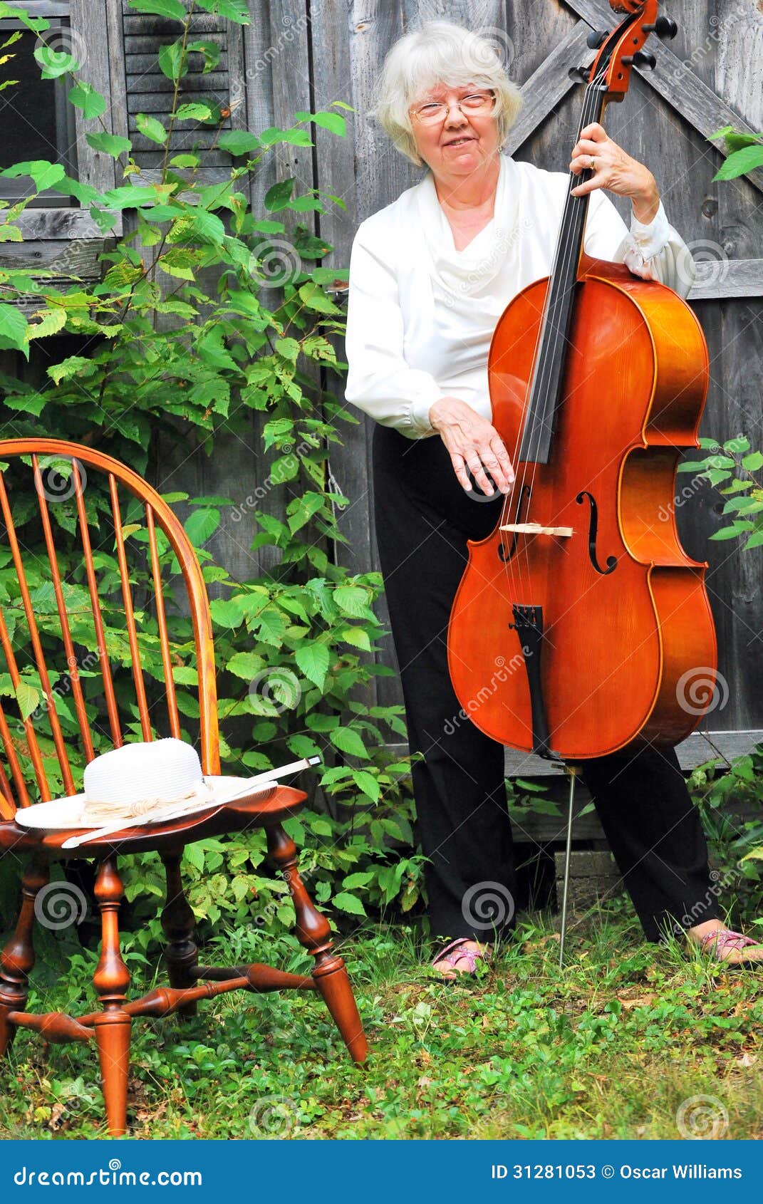 Mature female cellist. stock image. Image of people, wooden - 31281053