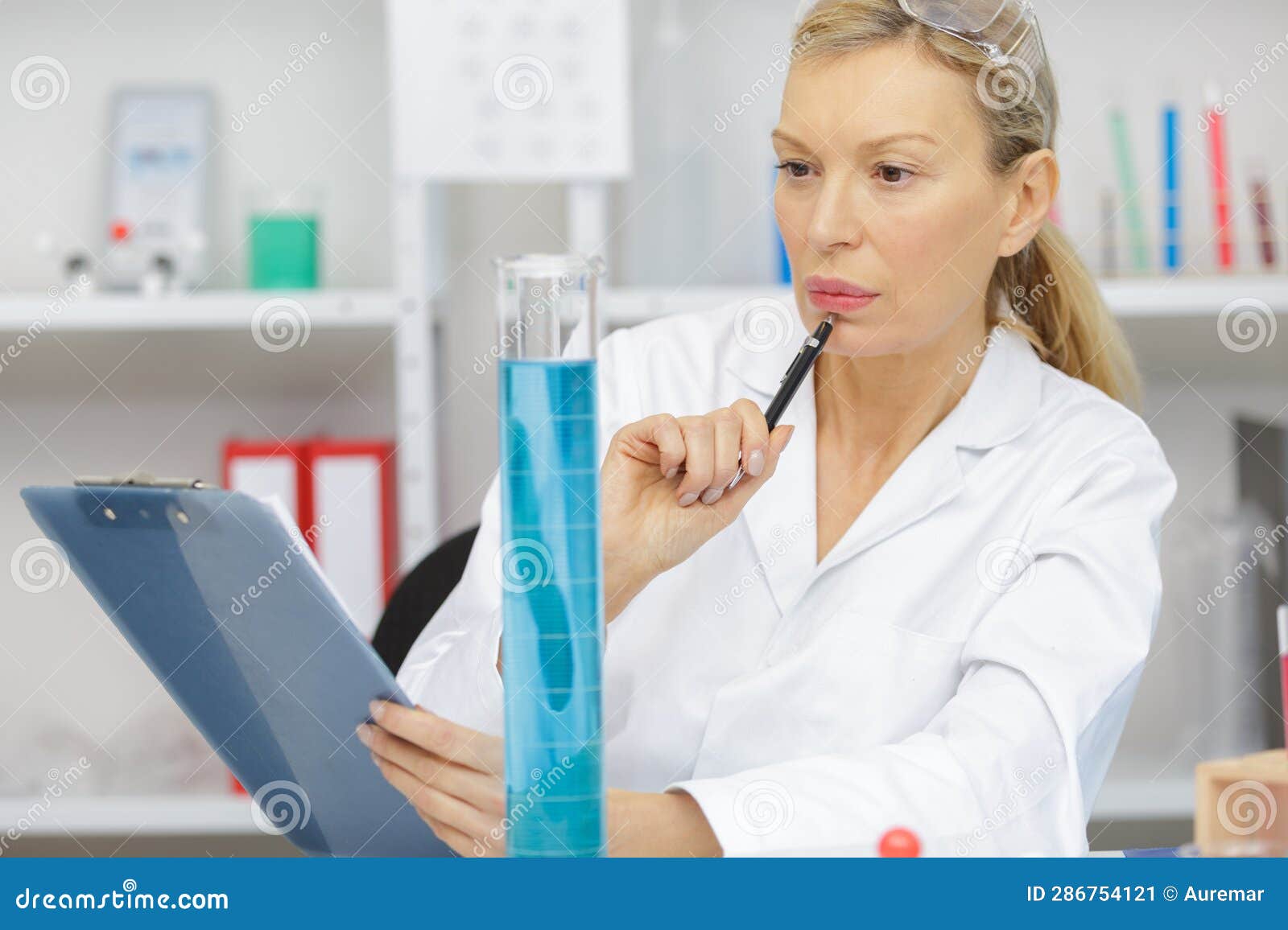 Mature Female Lab Worker Holding Test Tube Stock Image - Image of ...