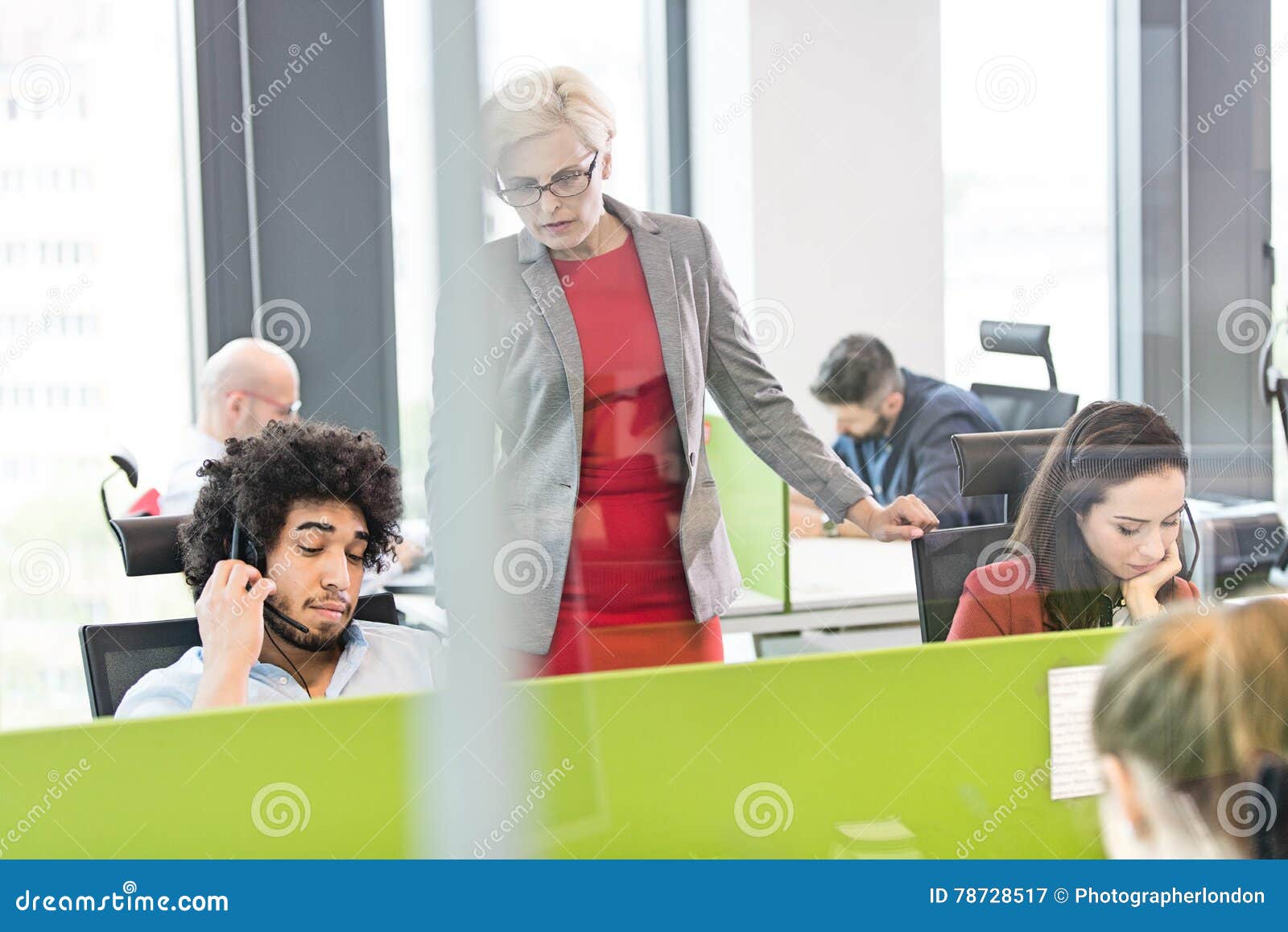Mature Female Manager with Operators Working in Office Stock Image ...