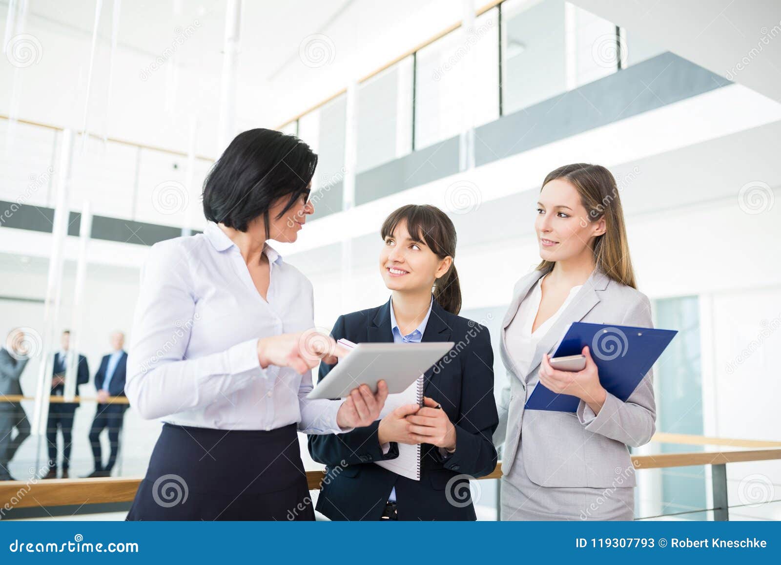 Professional Explaining Project To Colleagues on Tablet Computer Stock ...