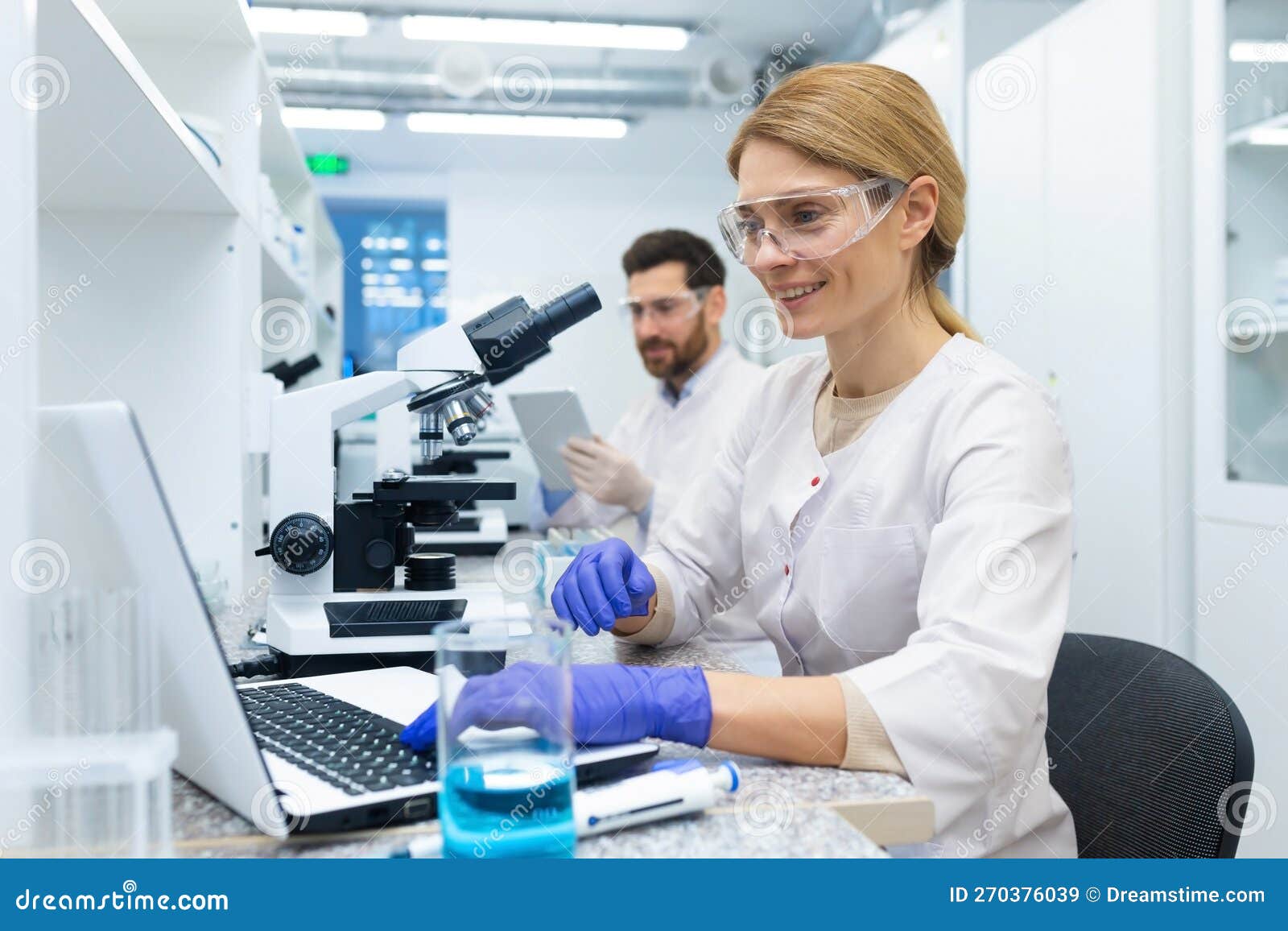 Mature Female Scientist in White Coat at Work, Laboratory Assistant ...