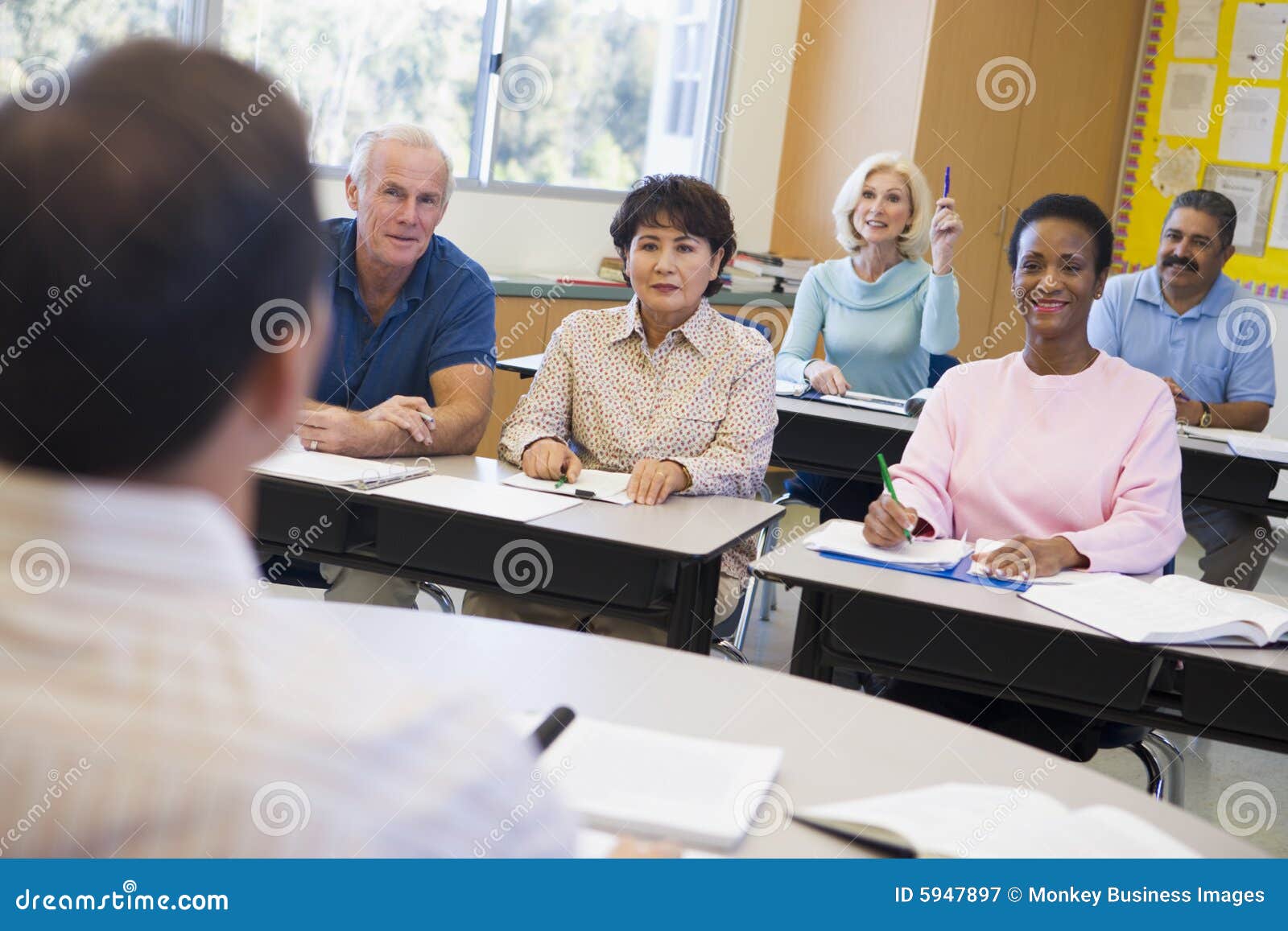 Mature Female Student Raising Hand in Class Stock Image - Image of hand ...