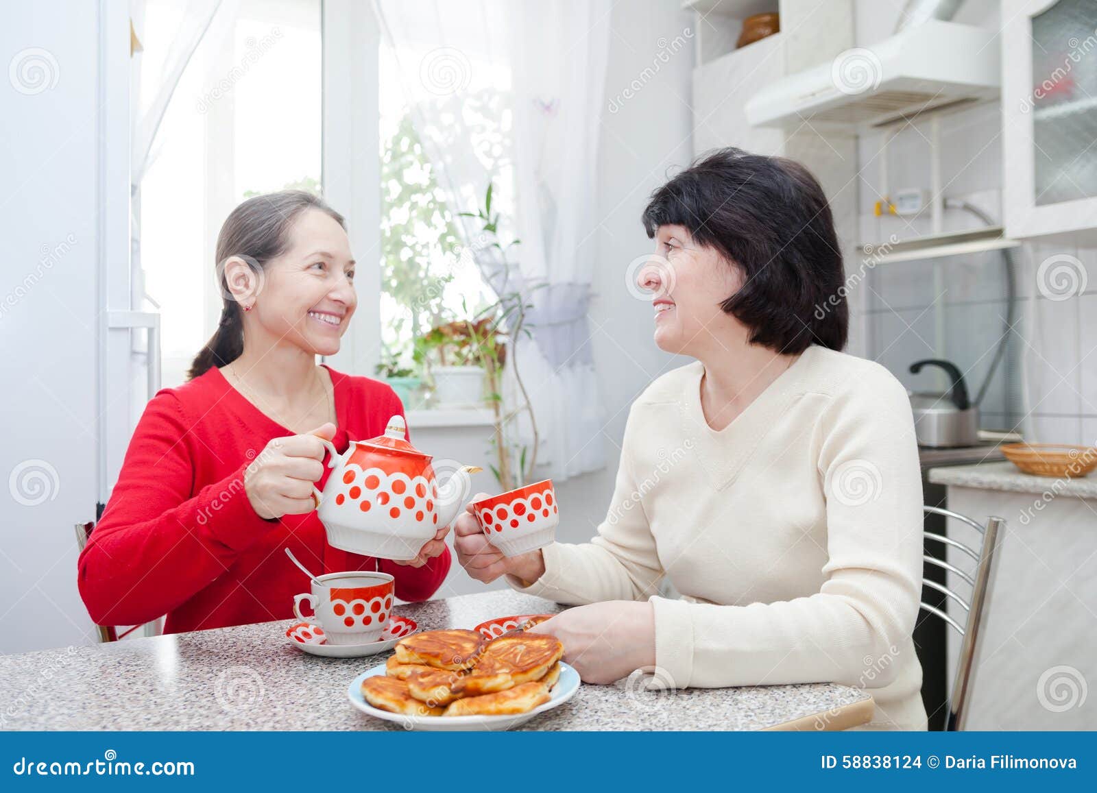 Mature Girlfriends Talking Over Tea Stock Photo - Image of people ...