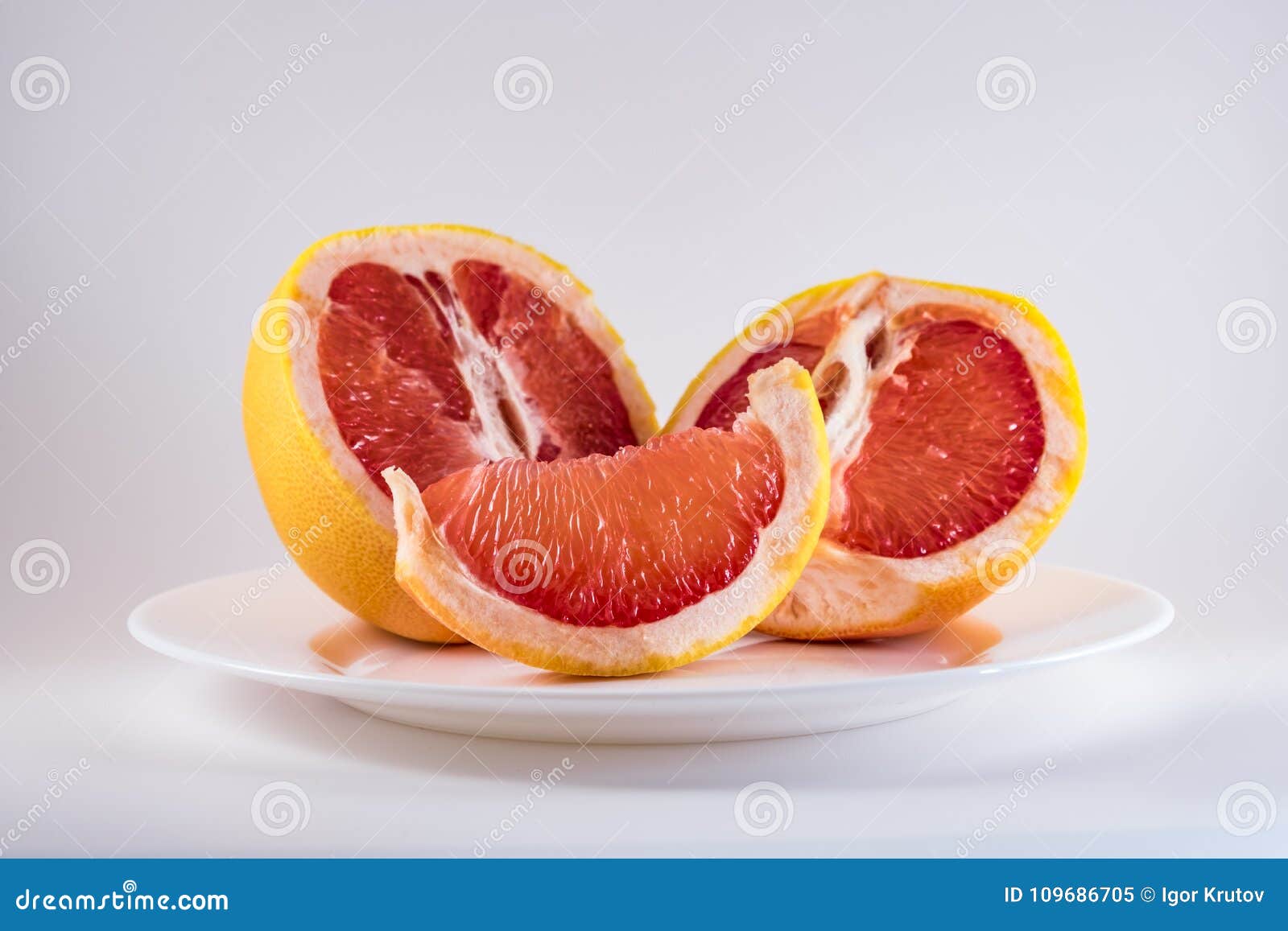 Mature Grapefruit on a White Plate Close-up Stock Image - Image of ...