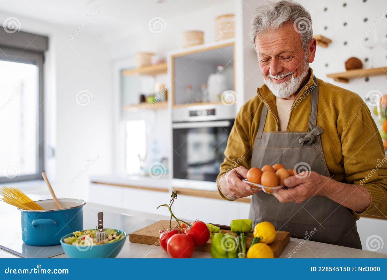 Mature Handsome Man Cooking in Home Kitchen Stock Photo - Image of ...