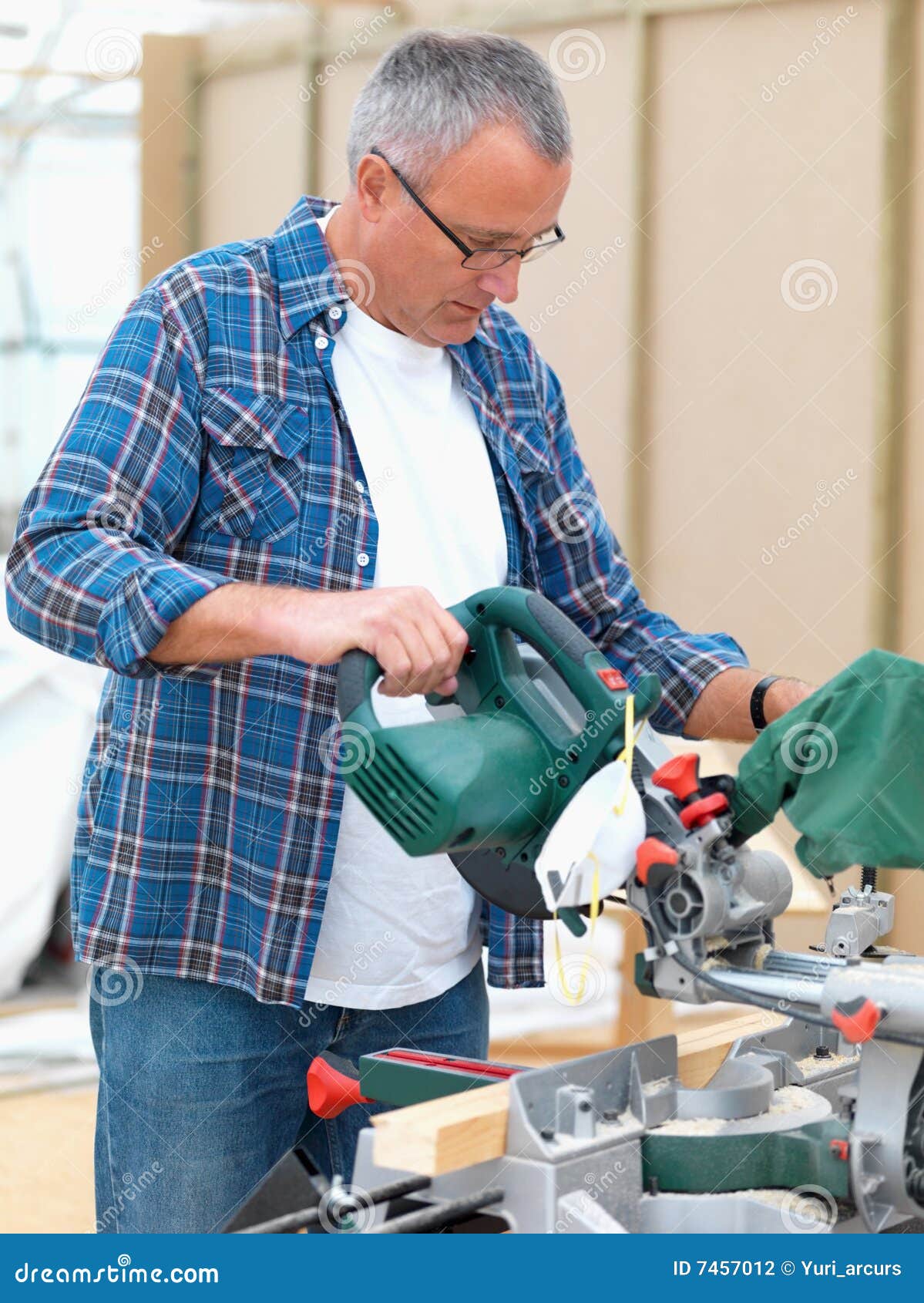Mature Handy Man Using an Electric Saw Stock Photo - Image of power ...