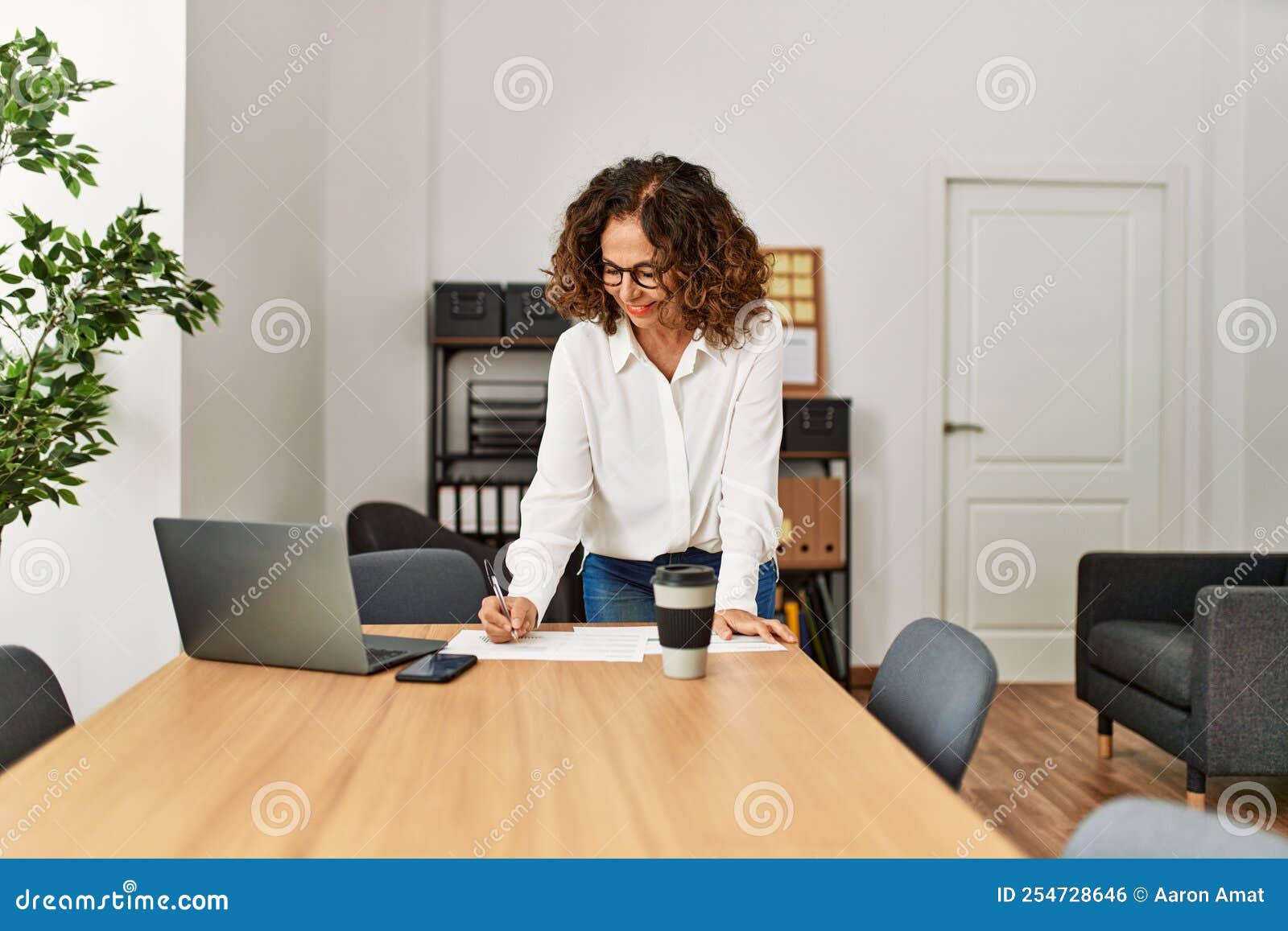 Mature Hispanic Woman Working at the Office Stock Photo - Image of boss ...