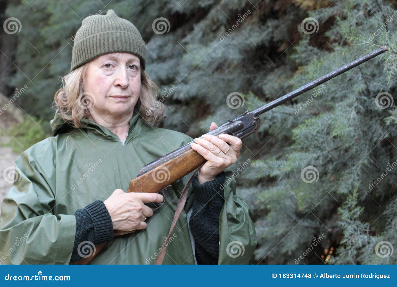 Mature Huntress Holding a Rifle Stock Photo - Image of nature ...