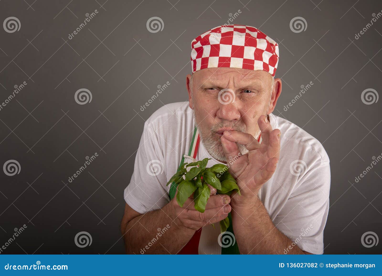 Mature Italian Chef Smelling Basil Leaves Stock Photo - Image of ...