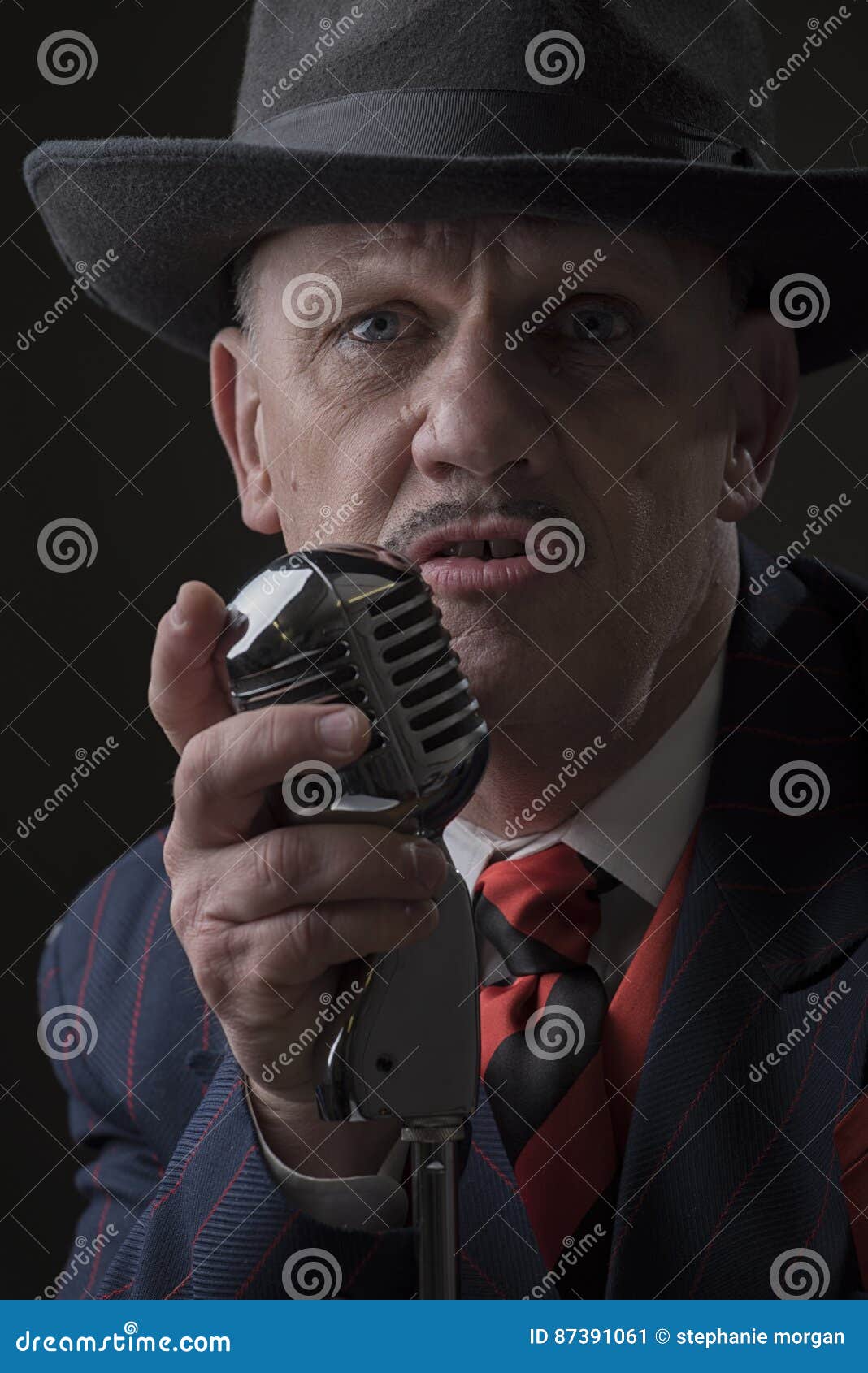 Mature Jazz Man Singing into a Microphone Stock Image - Image of ...