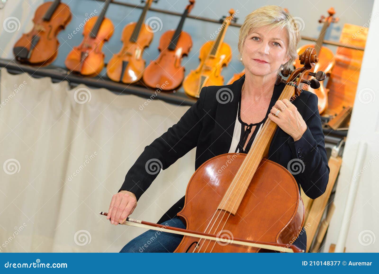 Mature lady playing cello stock image. Image of musical - 210148377