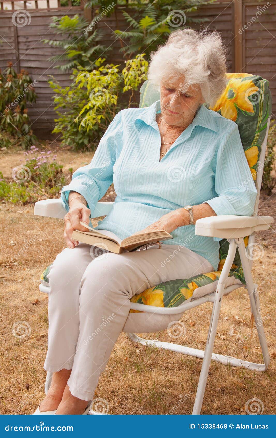 Mature Lady Reading in the Garden Stock Photo - Image of portrait, lady ...