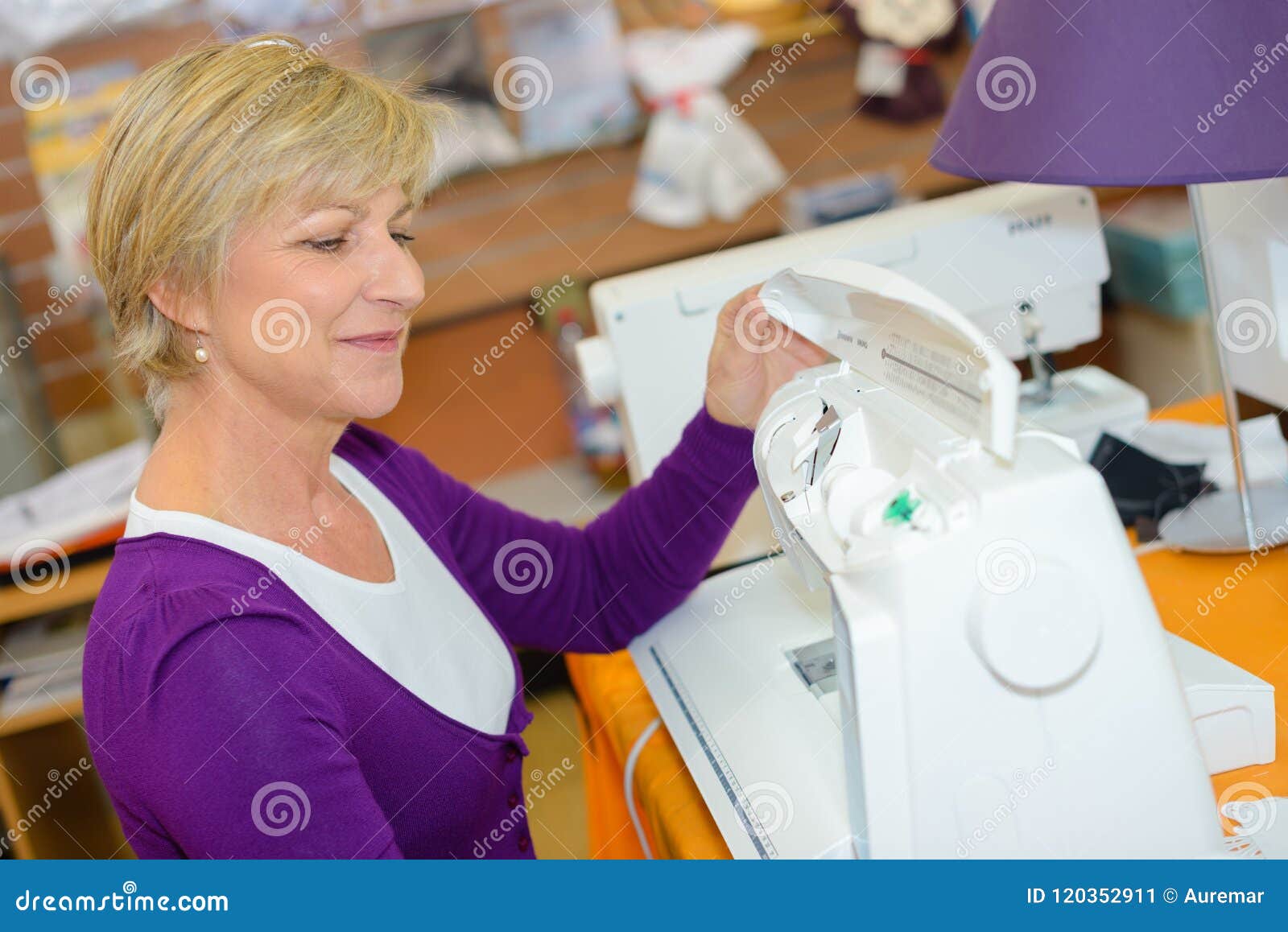 Mature Lady Using Sewing Machine Stock Image - Image of needle, sitting ...