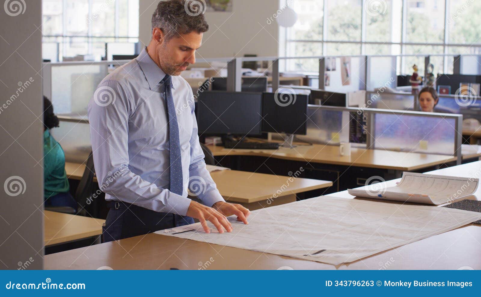 Mature Male Architect Standing in Modern Open Plan Office Studying ...
