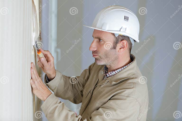 Mature Male Builder Stripping Wallpaper with Scraper Stock Image ...
