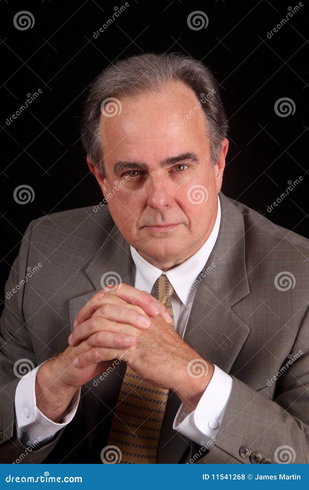 Mature Male Businessman with a Serious Expression Stock Photo - Image ... Mature Male Businessman with a Serious Expression Stock Photo - Image ...