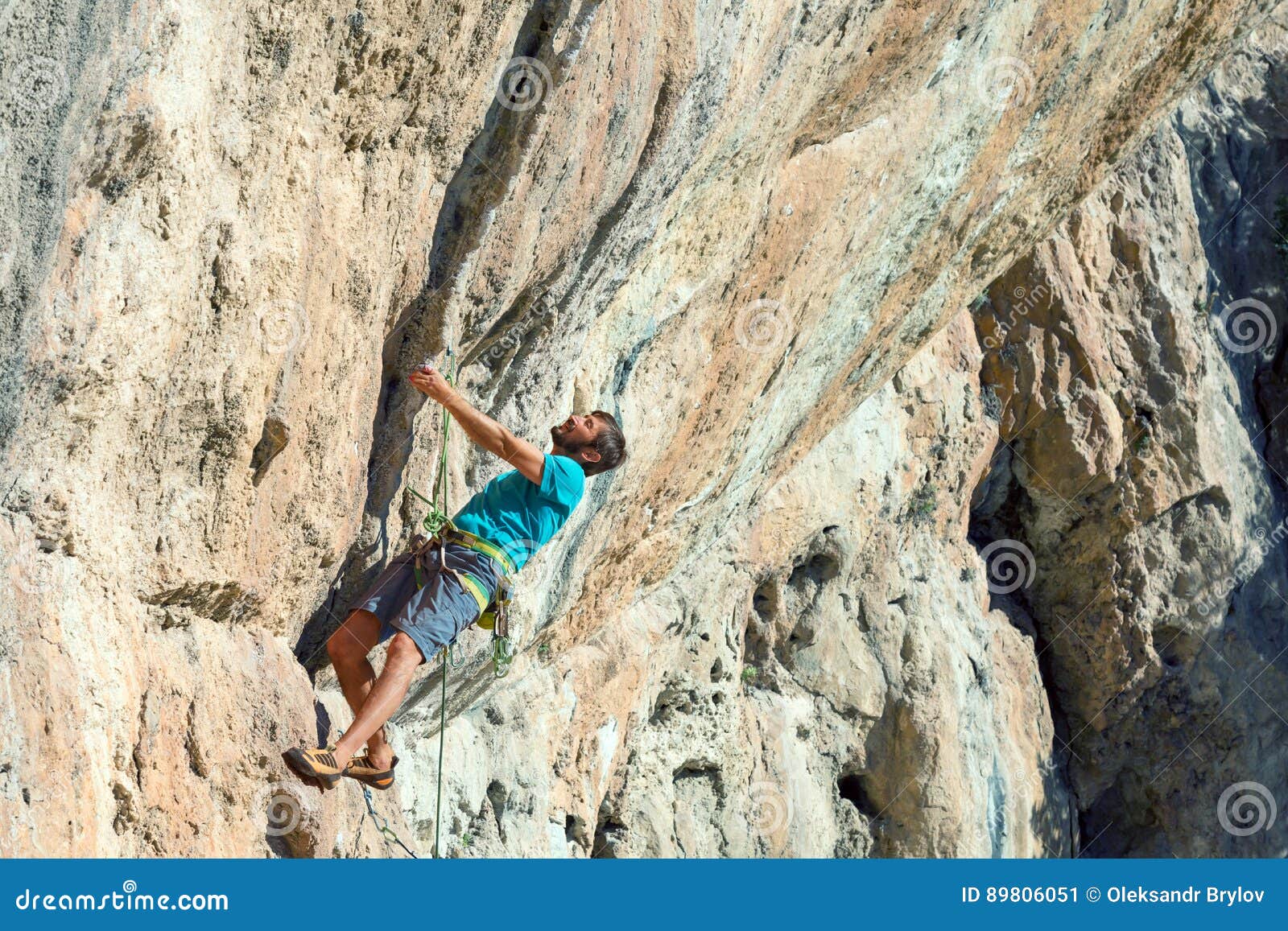 Mature Male Climber Making Risky Move on Dangerous Rock Stock Image ...