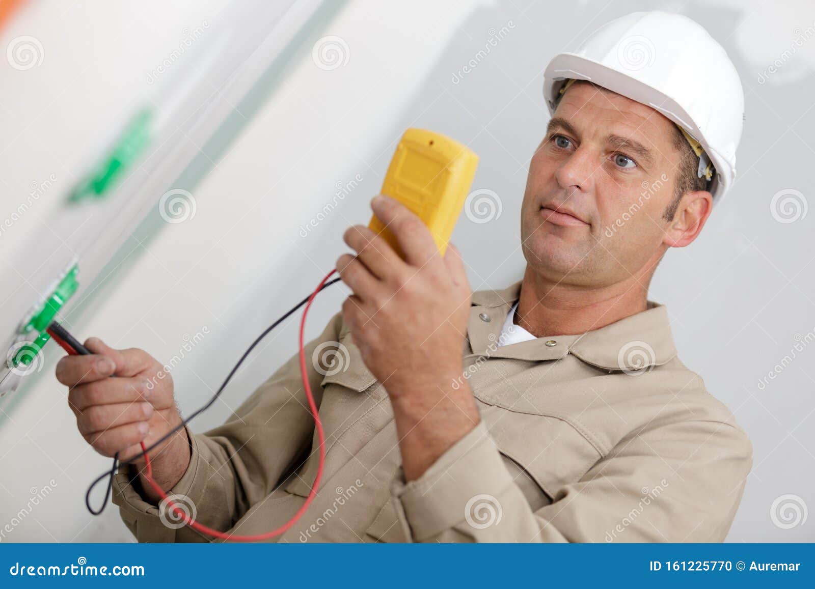 Mature Male Electrician Using Multimeter Stock Photo - Image of house ...