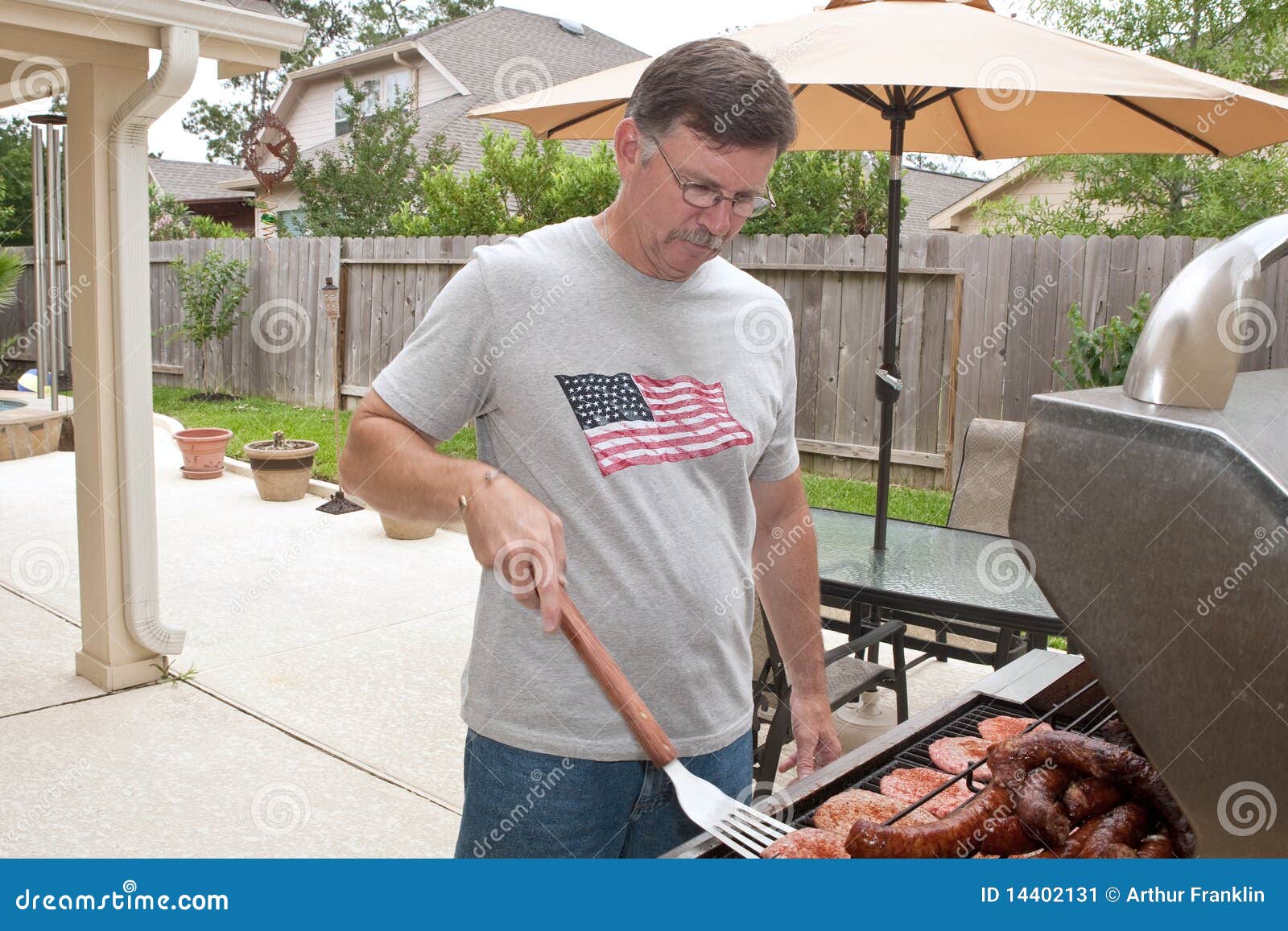 Mature man barbecuing stock image. Image of dinner, handsome - 14402131