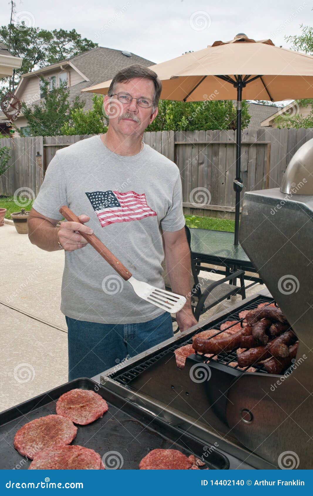 Mature man barbecuing stock photo. Image of burgers, handsome - 14402140
