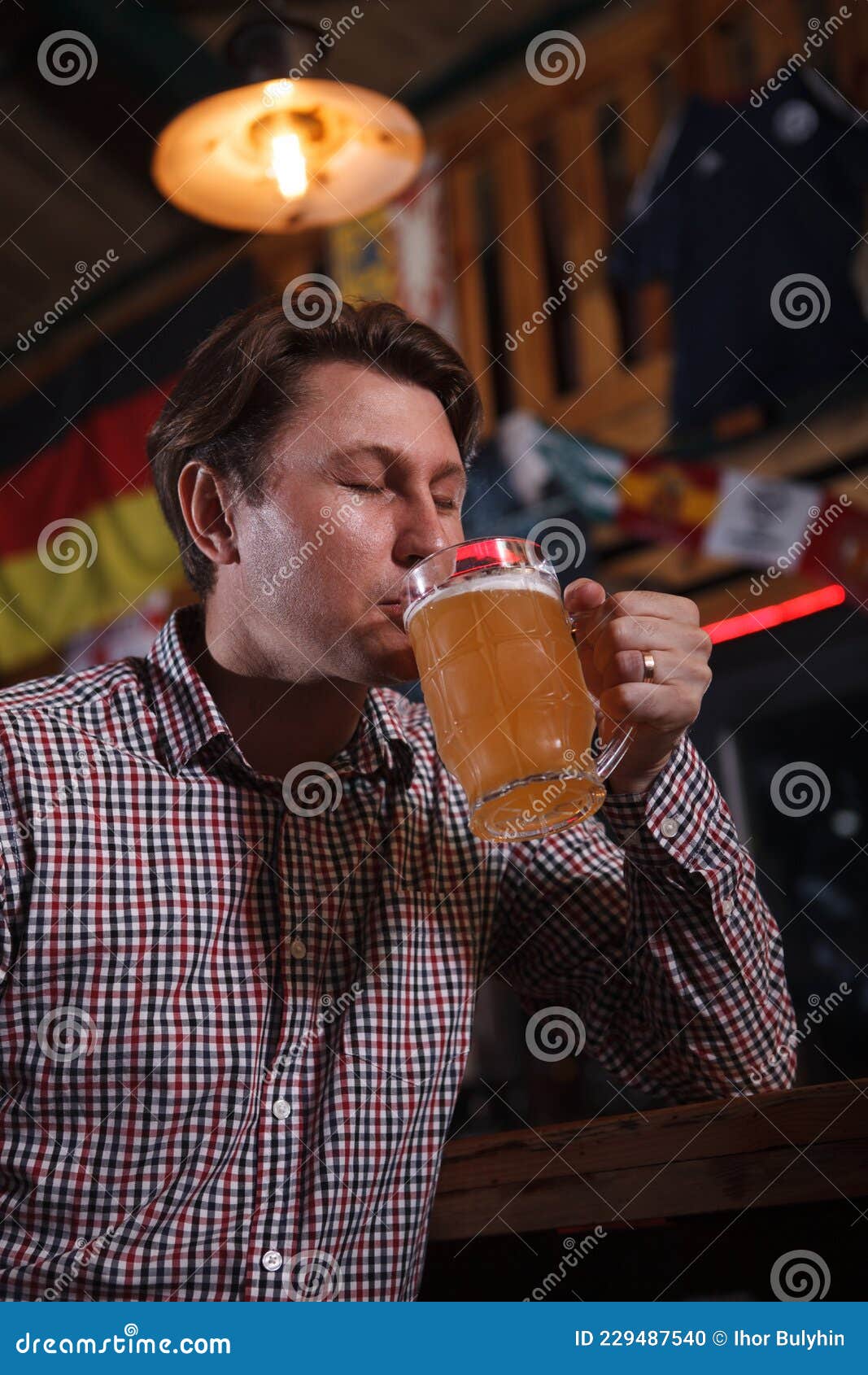 Mature Man Drinking Beer at the Pub Stock Photo - Image of restaurant ...