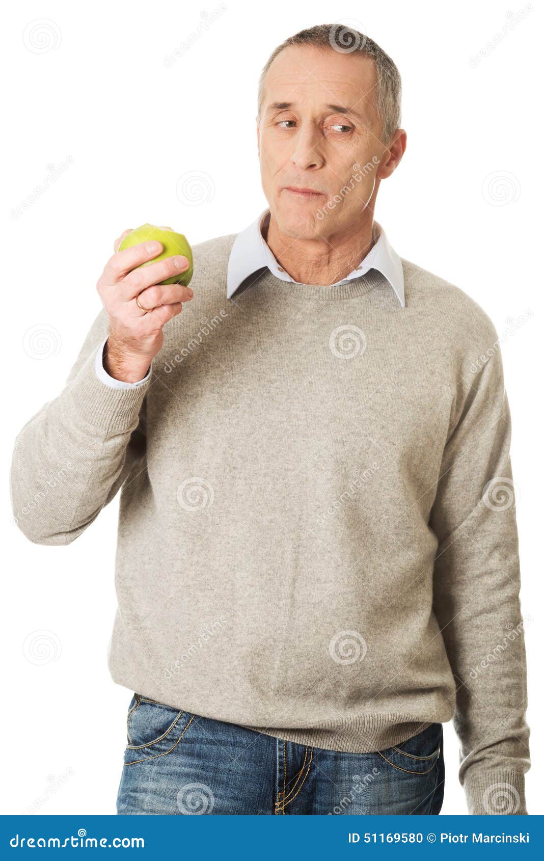 Mature man eating an apple stock photo. Image of hold - 51169580
