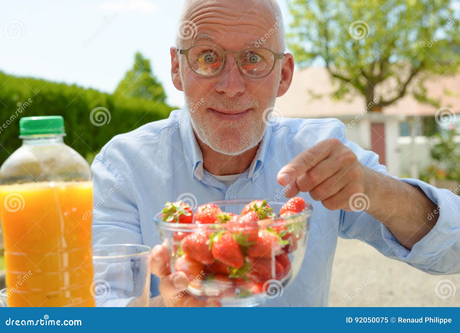 Mature Man Eating Strawberry, Outside Stock Image - Image of senior ...