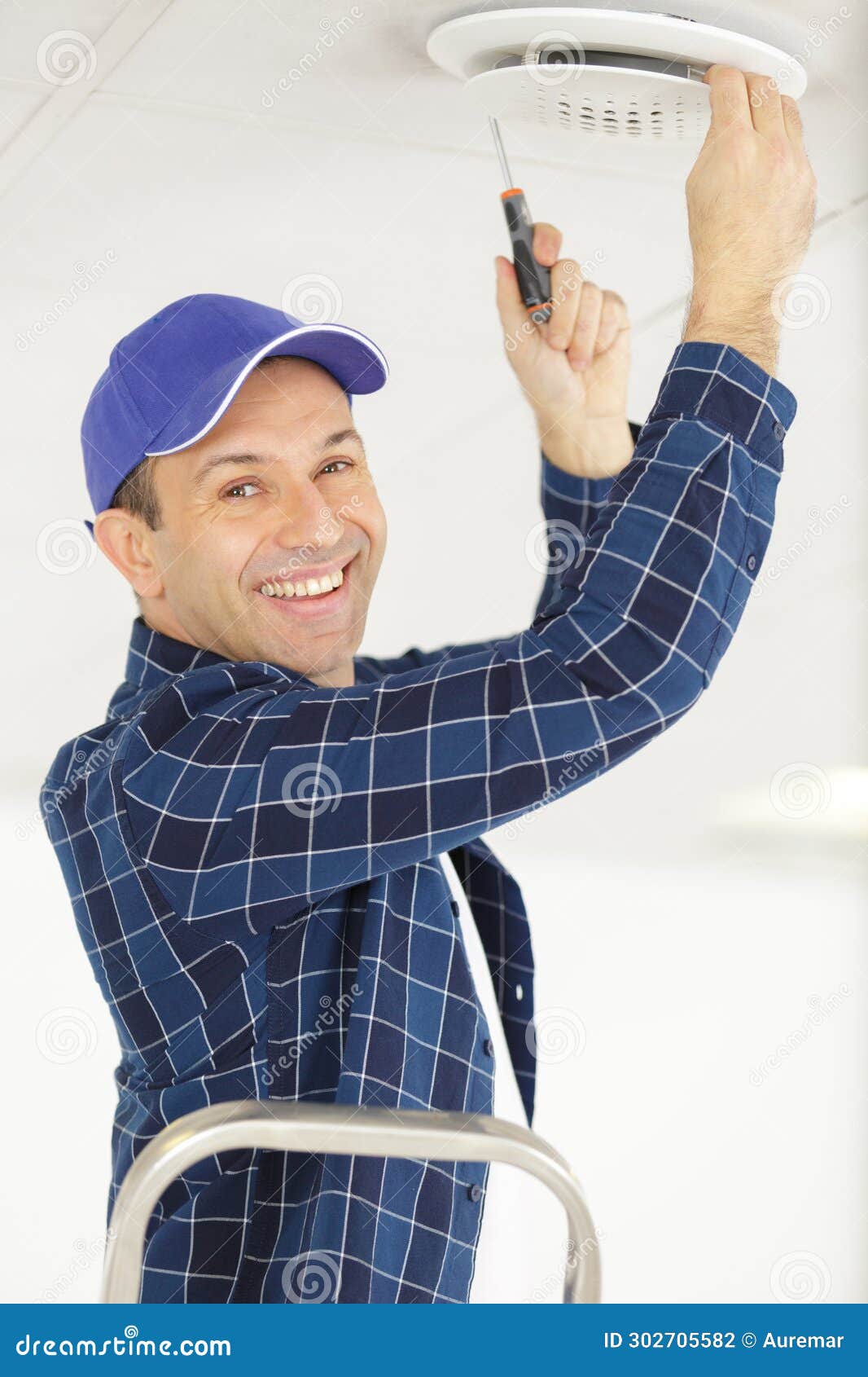 Mature Man Fitting Ceiling Vent Stock Photo - Image of tool, peakedcap ...