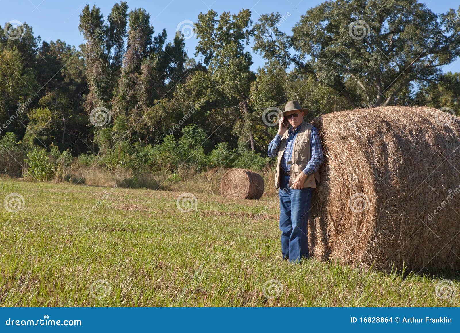 Mature man and hay stack stock photo. Image of stack - 16828864